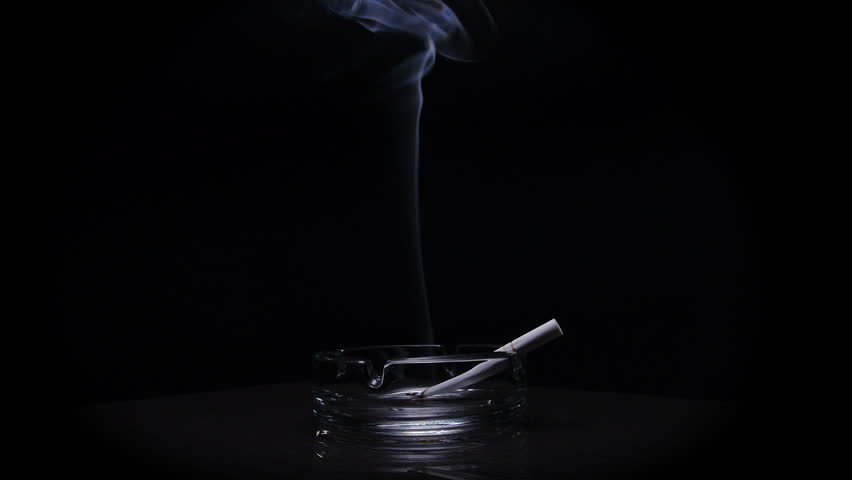 Cigarette In An Ashtray On A Black Background. Ashtray With Cigarette ...