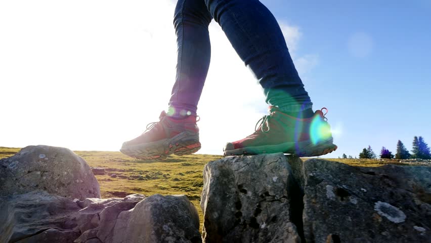Female Hiker Walking On Rough Terrain. Foot Steps In Slow Motion ...