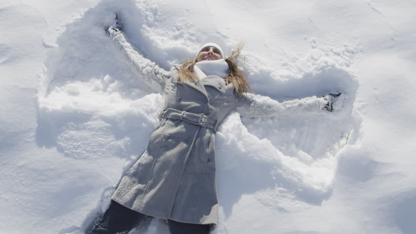 SLOW MOTION: Young Woman Making Snow Angels Stock Footage Video 4308566 ...