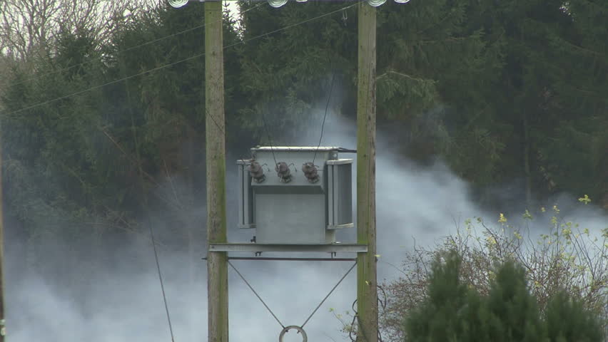 Smoke Rises Behind A High Voltage Electricity Transformer. Vídeo stock ...