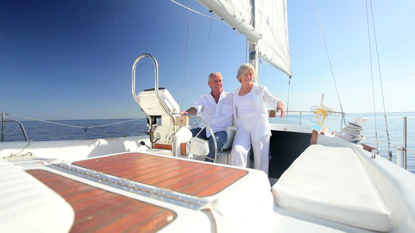 Healthy Retired Couple Enjoying Life Aboard Their Luxury Sailing Yacht ...