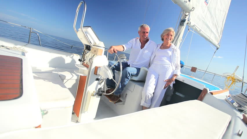 Healthy Retired Couple Enjoying Life Aboard Their Luxury Sailing Yacht ...